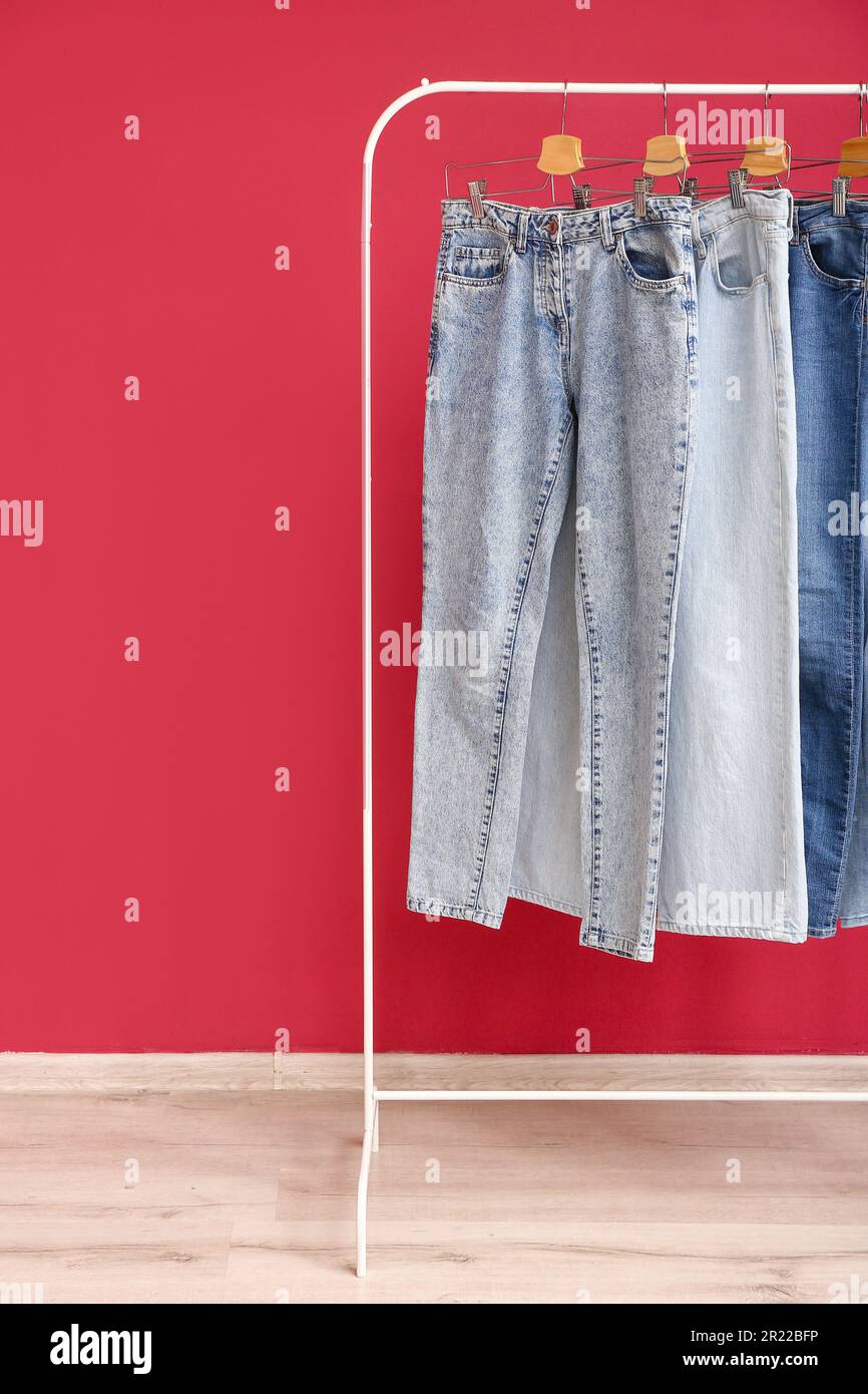 Many stylish jeans hanging hi-res stock photography and images - Alamy
