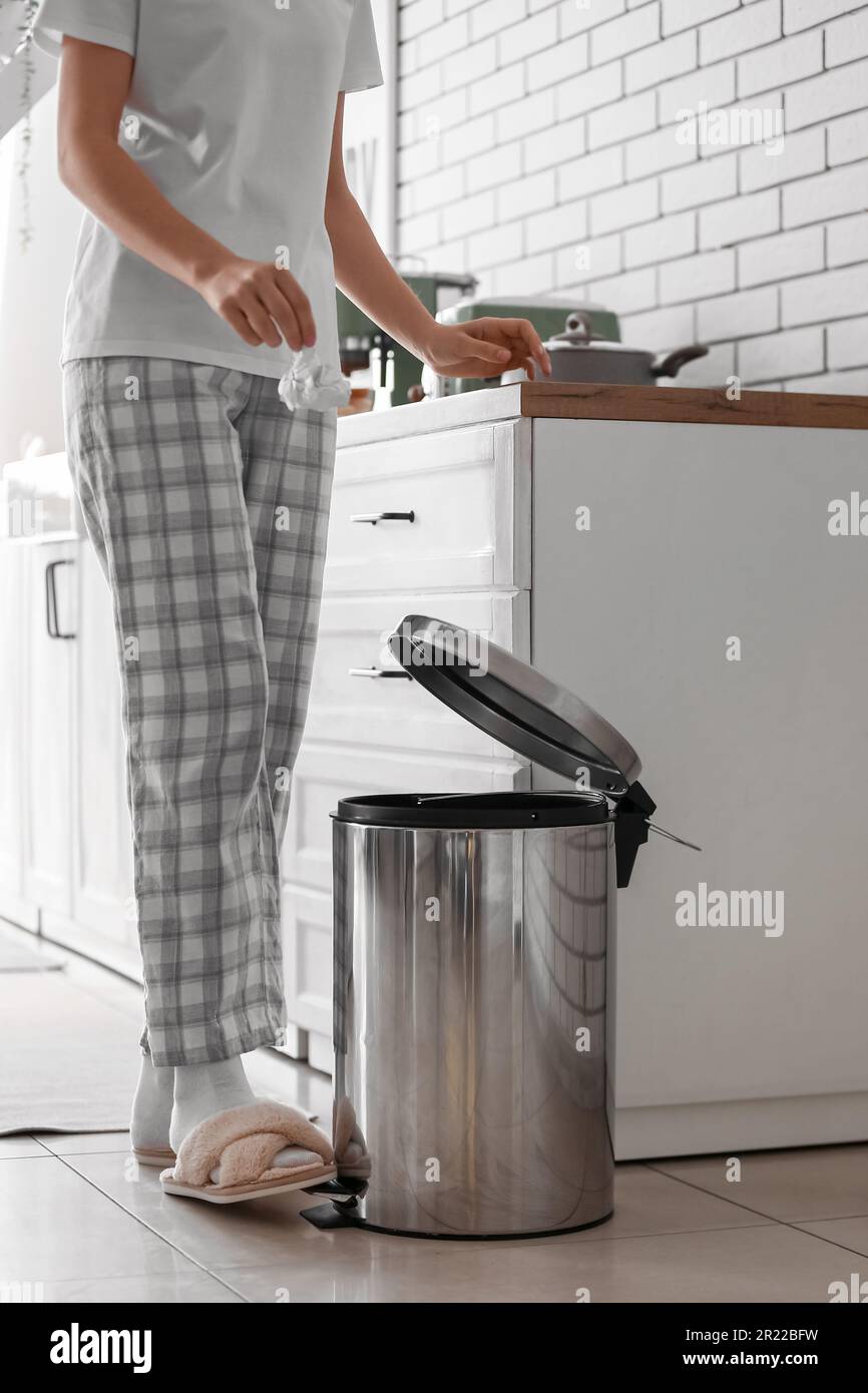 Woman throwing rubbish in white hi-res stock photography and images - Alamy