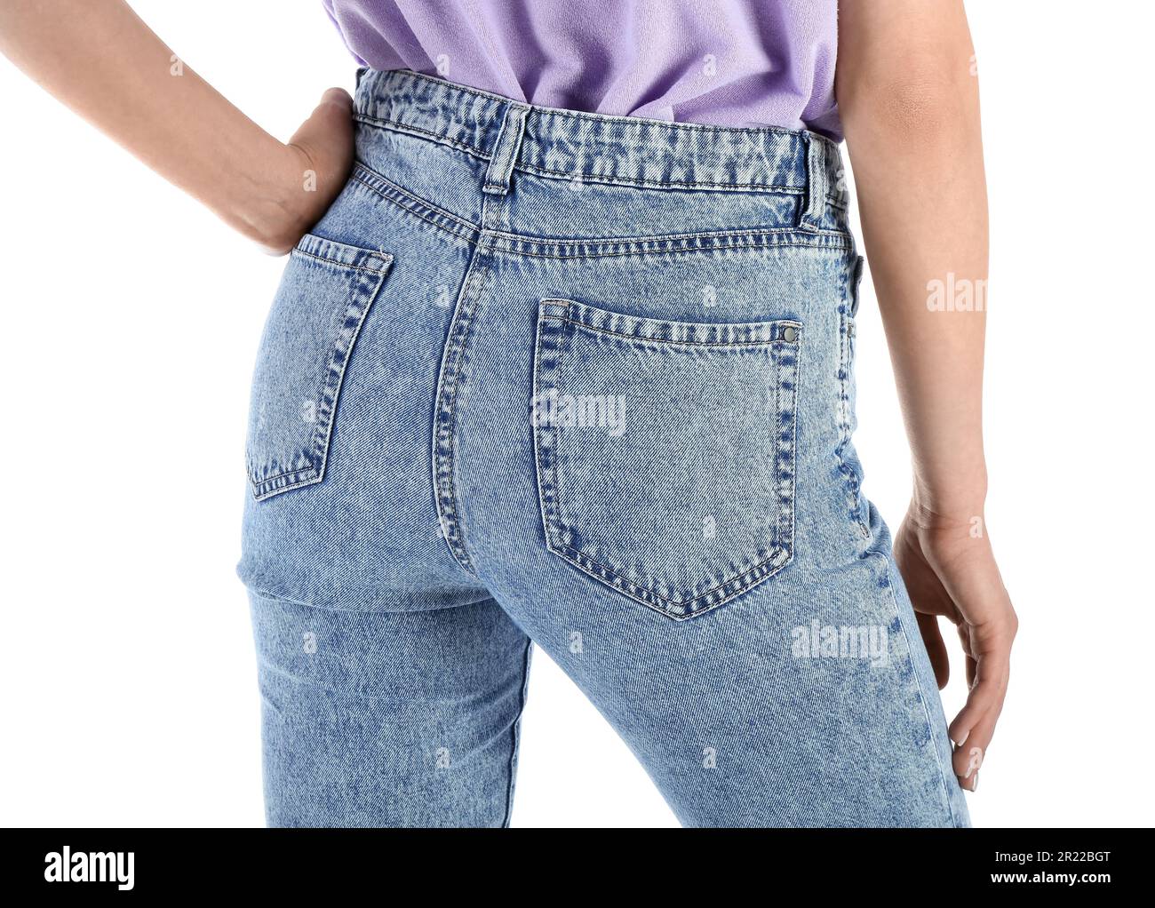 Young woman in stylish jeans on white background, back view Stock Photo ...