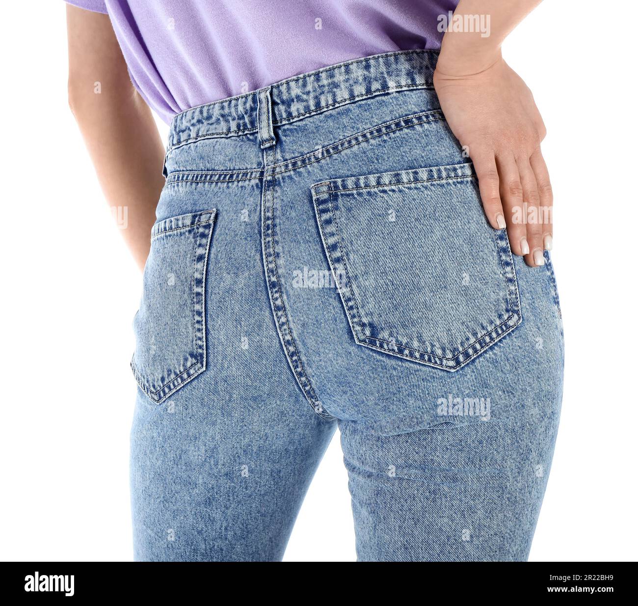 Young woman in stylish jeans on white background, back view Stock Photo ...