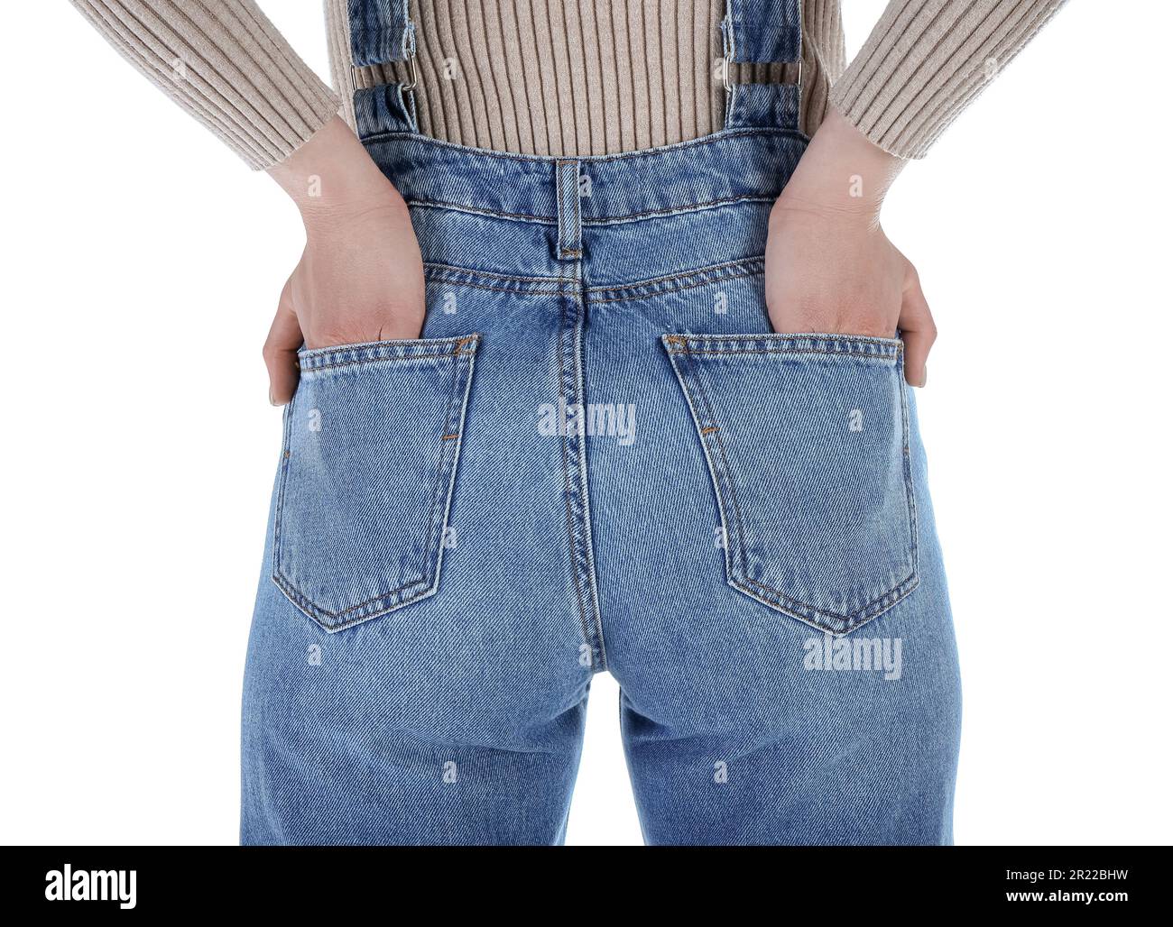 Young woman in denim jumpsuit on white background, back view Stock ...