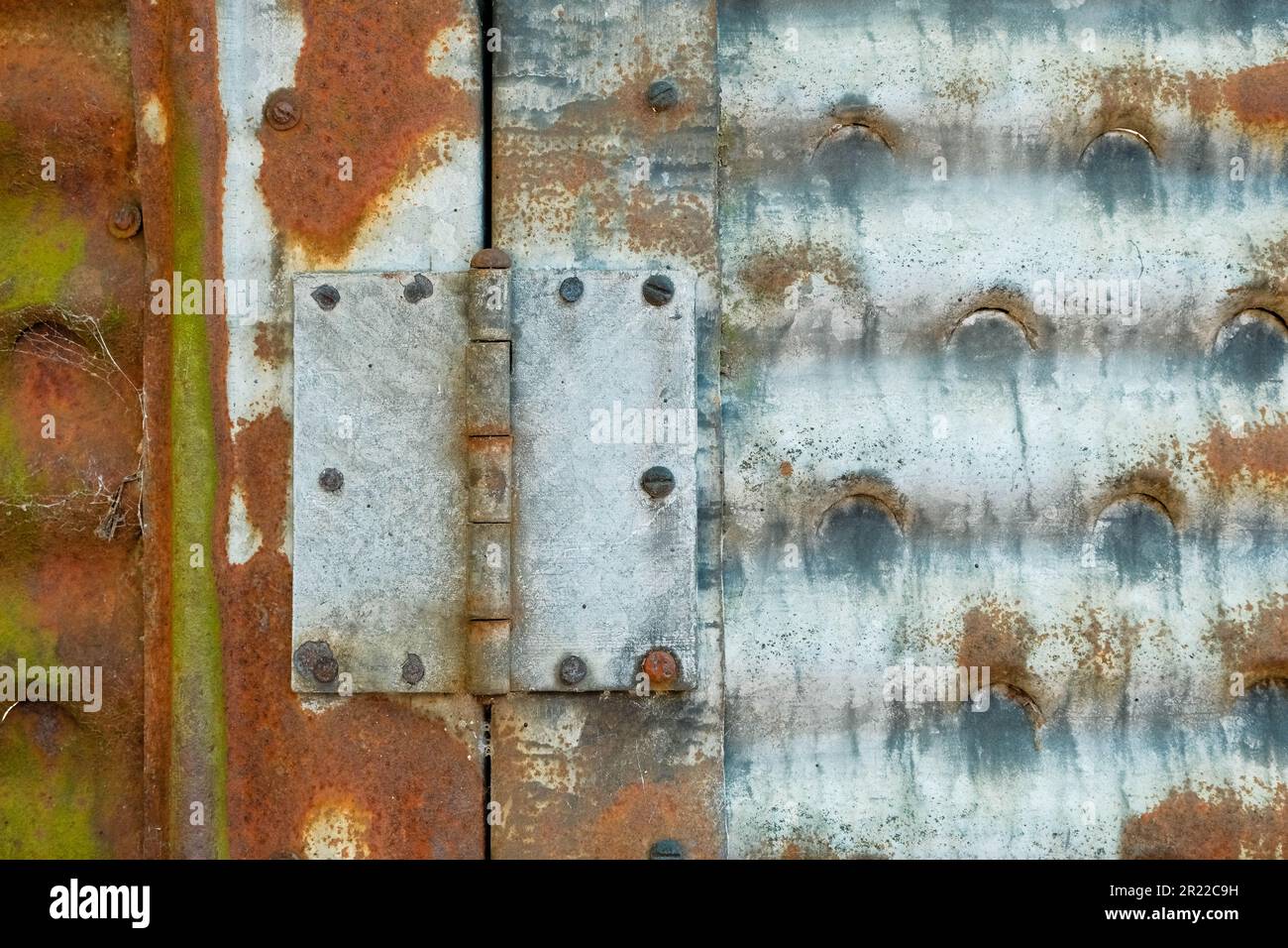 Solid hinge on oxidisng, galvanised metal structure Stock Photo - Alamy