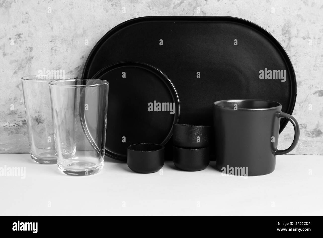 Set tableware on grey Black and White Stock Photos & Images - Alamy