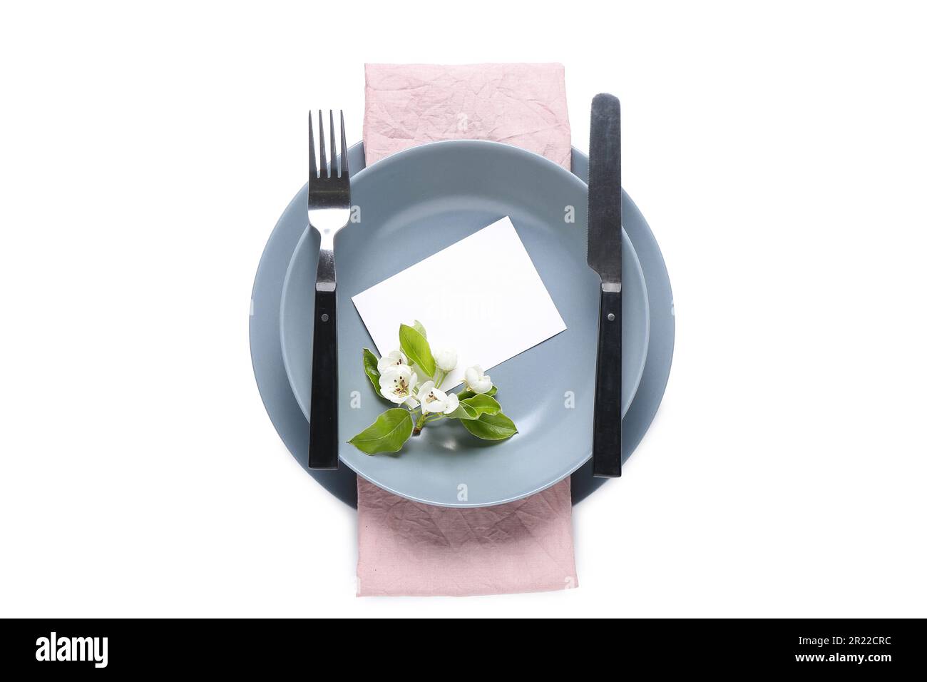 Beautiful table setting with blooming tree branch and blank invitation ...