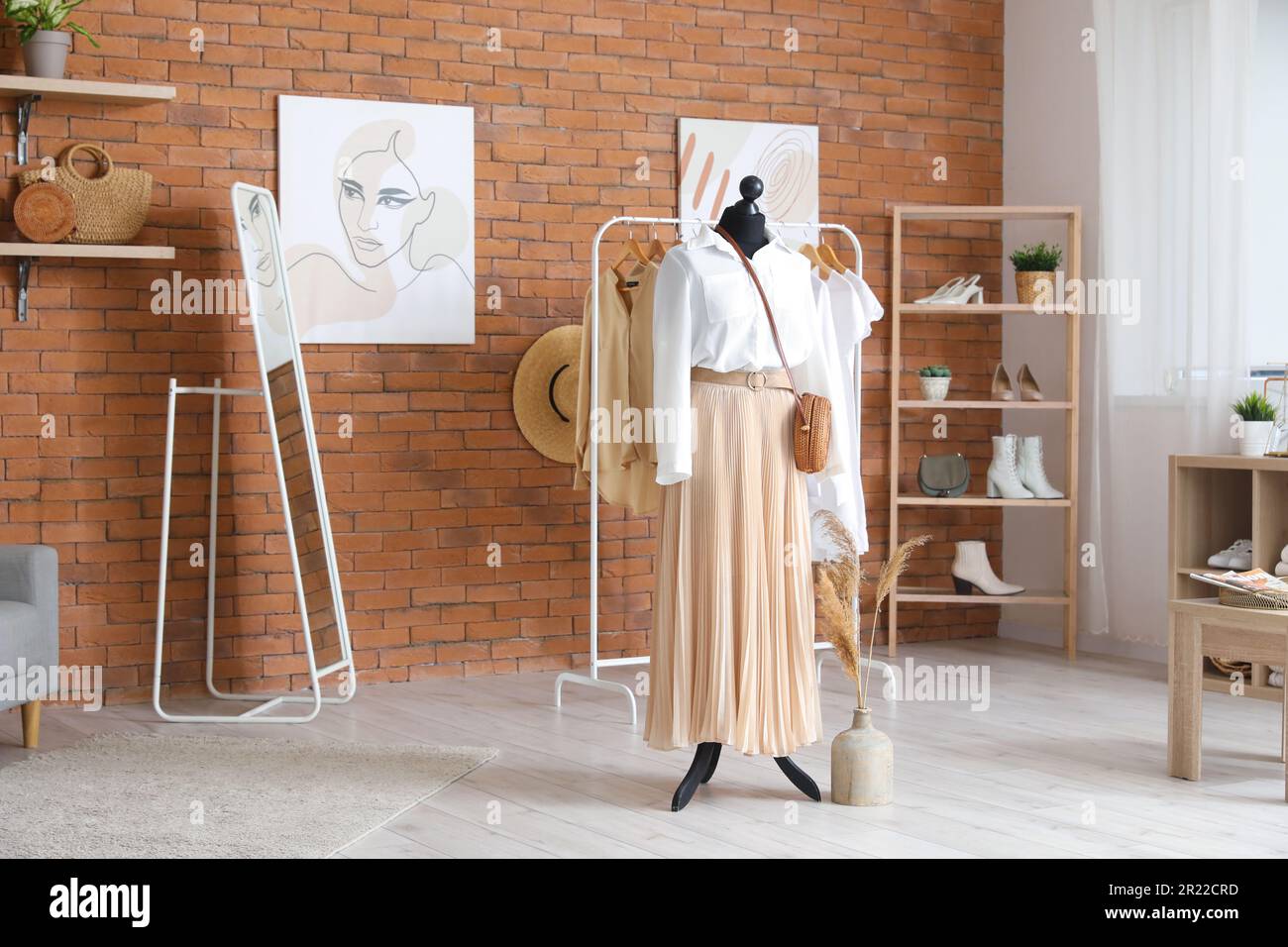 Interior of modern boutique with stylish female clothes and accessories ...