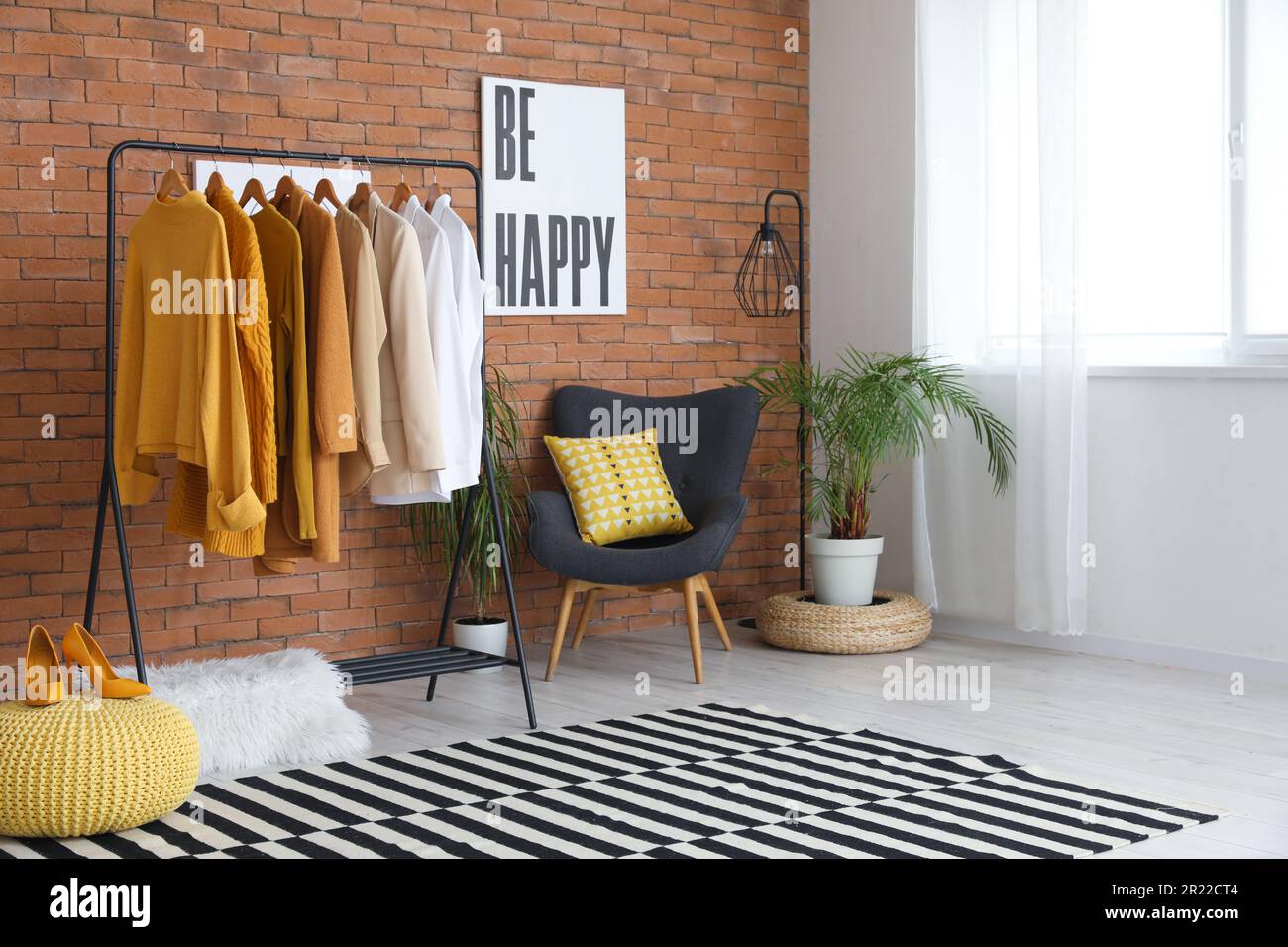 Rack with stylish female clothes in modern boutique Stock Photo - Alamy