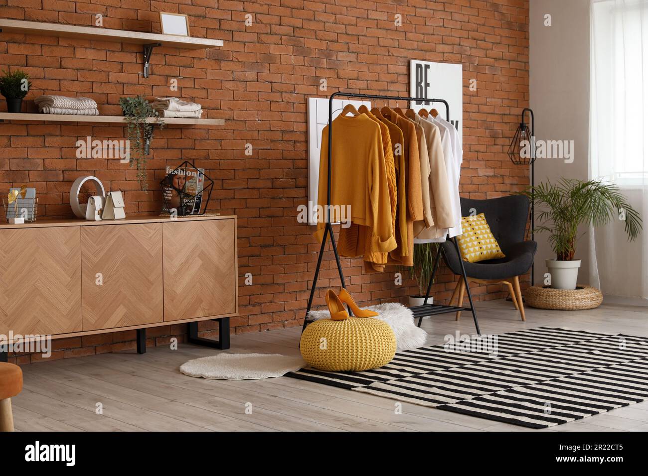 Rack with stylish female clothes in modern boutique Stock Photo - Alamy