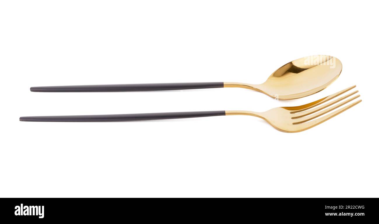 Golden spoon and fork with black handles on white background Stock ...