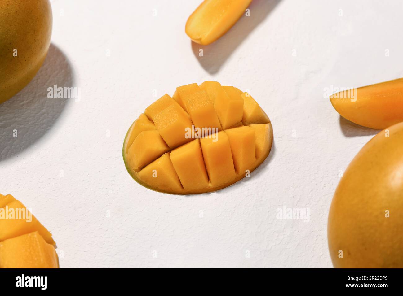 Fresh ripe mangoes on white background Stock Photo - Alamy