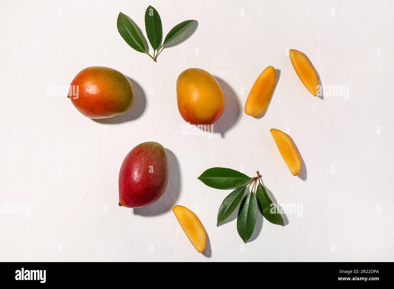 Fresh ripe mangoes on white background Stock Photo - Alamy