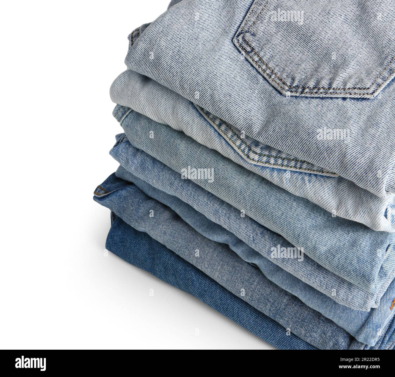 Different folded denim jeans on white background Stock Photo - Alamy