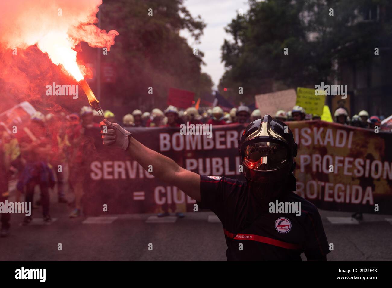 Firefighter holds smoke flare hi-res stock photography and images - Alamy