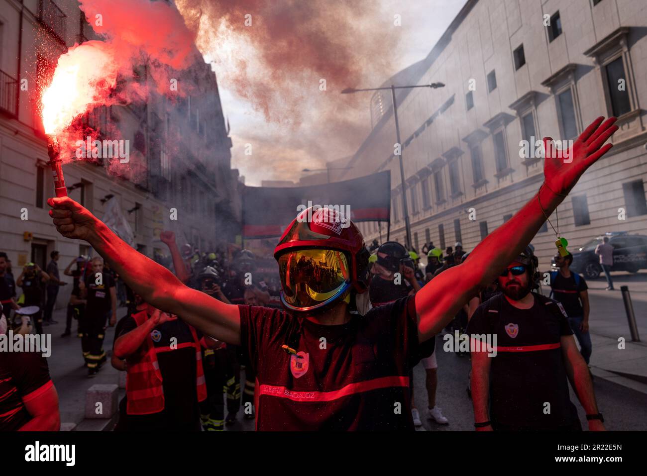 Madrid, Spain. 16th May, 2023. A firefighter holds a flare during the ...