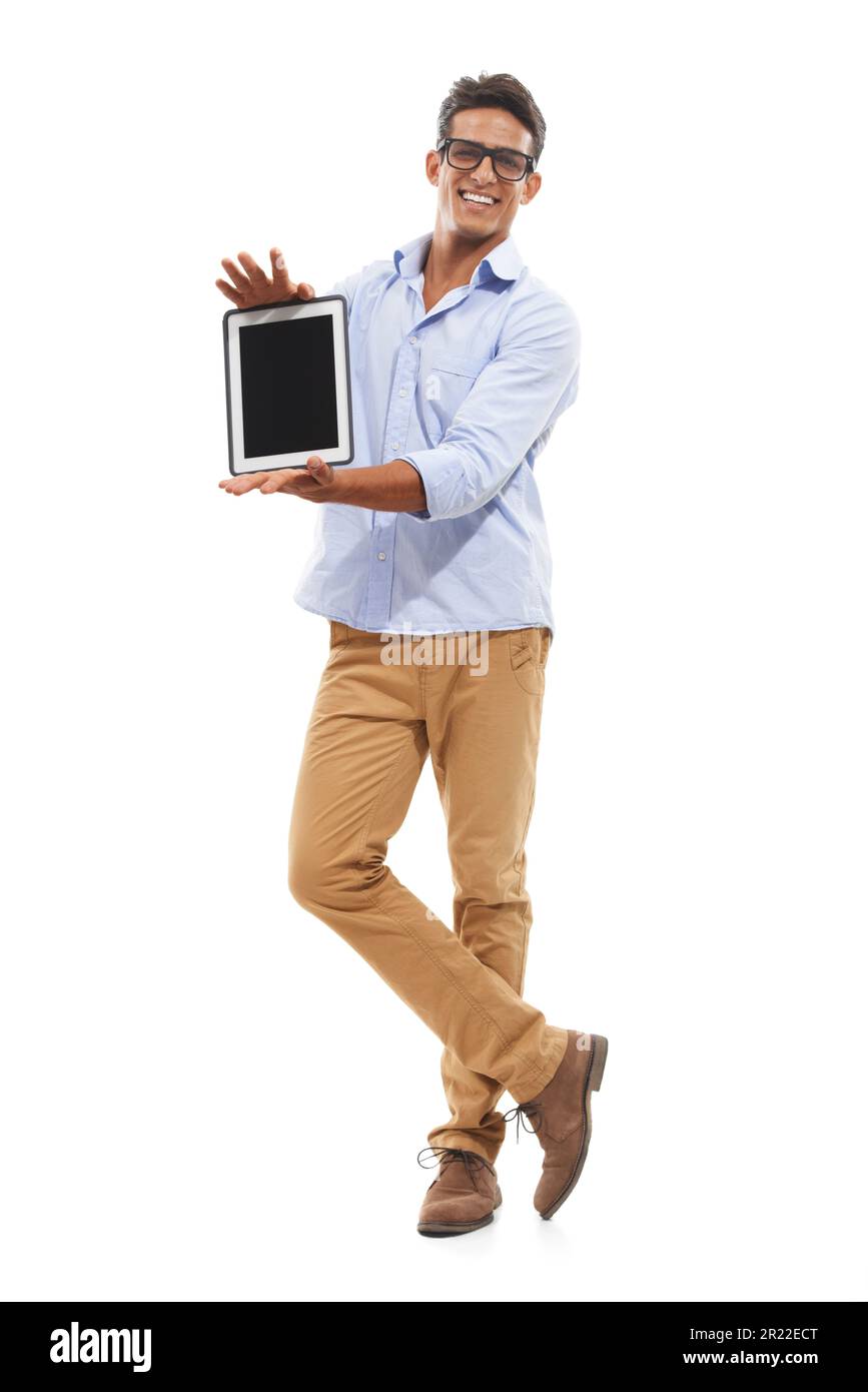 Presenting tablet technology. Full body portrait of a handsome young ...