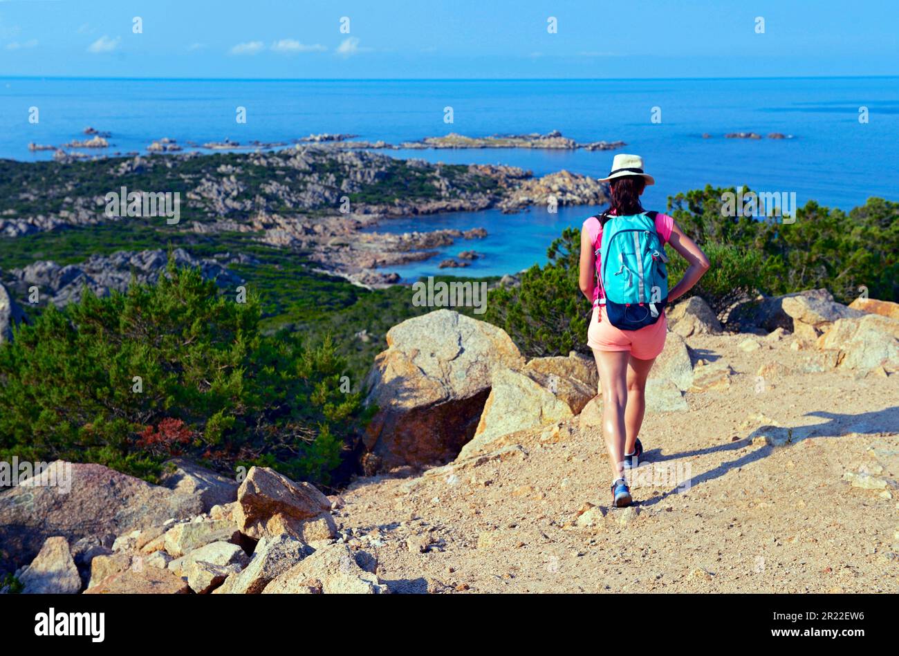 woman walking on the coast footpath of Bruzzi on north of Bonifacio ...