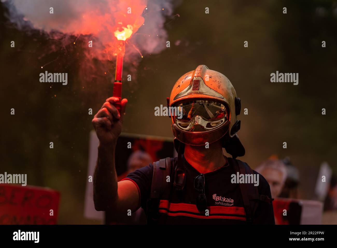 Madrid, Spain. 16th May, 2023. A Firefighters holds a flare during the ...