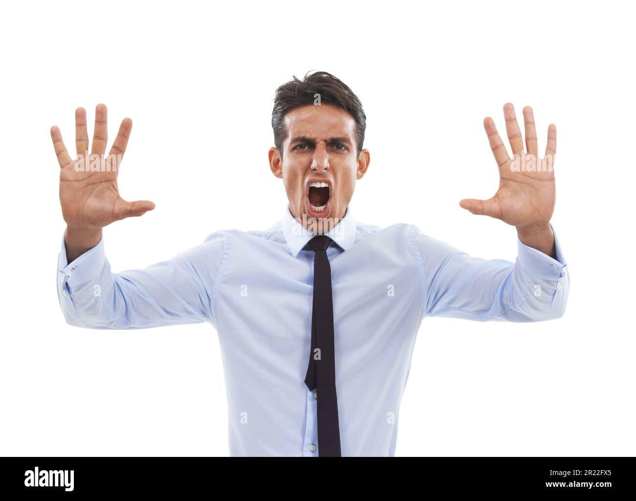 Hold your horses. Portrait of businessman shouting with both hands up ...