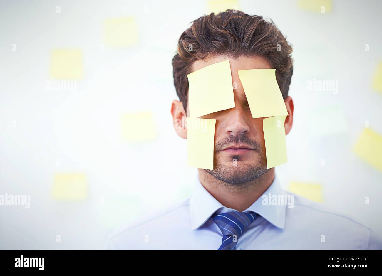 Feeling more than a little overwhelmed...a young businessman with ...