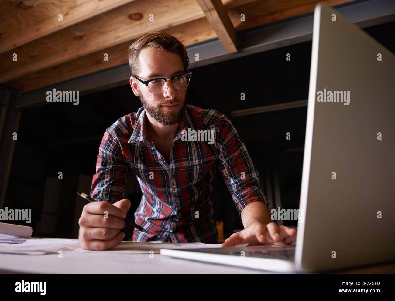 Turning his vision into reality. An architect drawing up plans Stock ...
