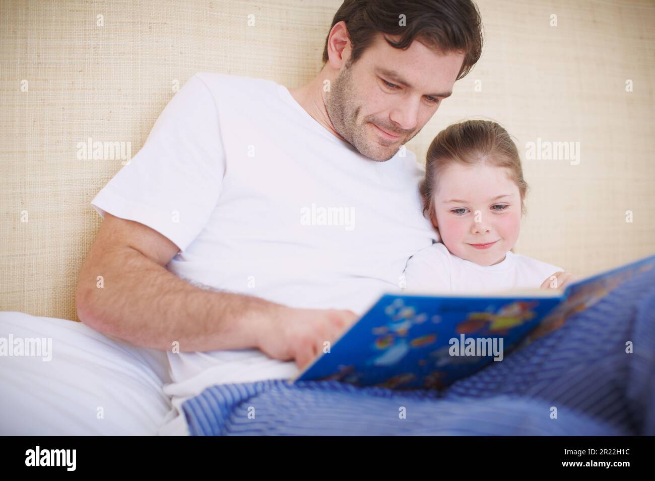 Once upon a time...A devoted father reading his young daughter a ...