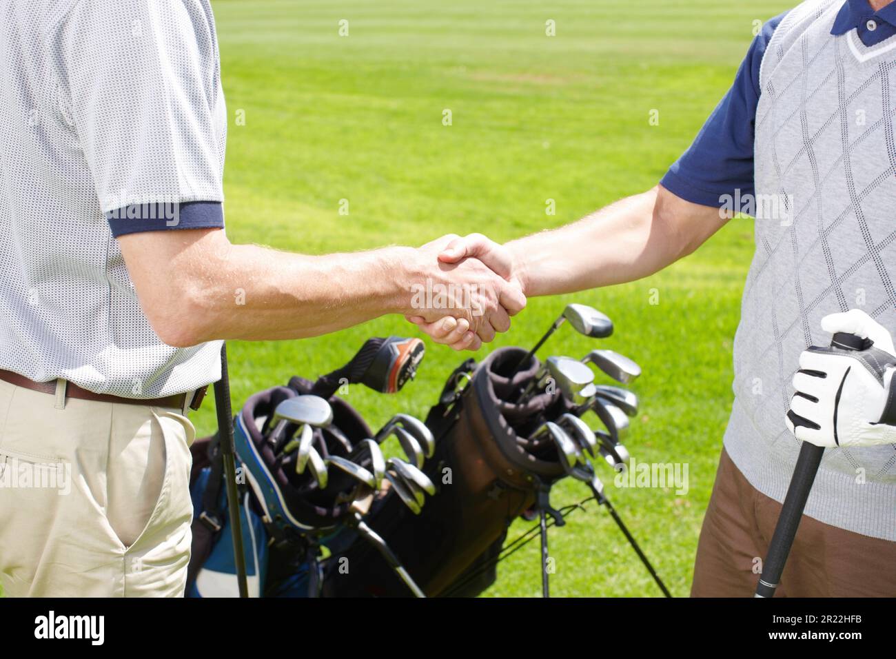 Congratulations on your game. Golfing partners shaking hands after a ...