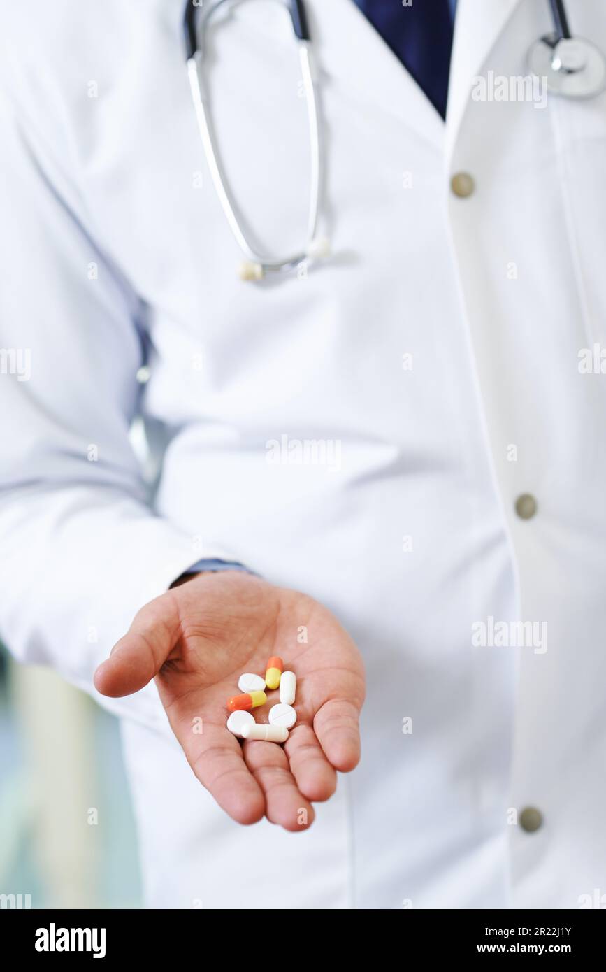 Handful of little lifesavers. Closeup of a doctors hand holding ...