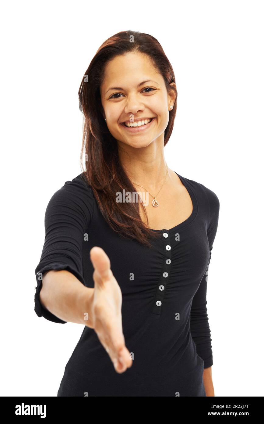 Pleased to meet you. Studio shot of a young woman extending a handshake ...