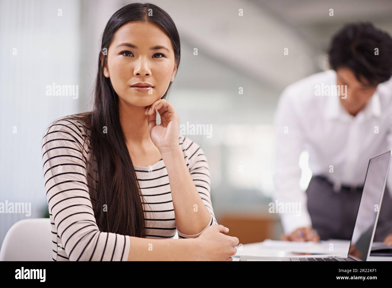 Every employee matters. An asian businesswoman sitting at her office ...