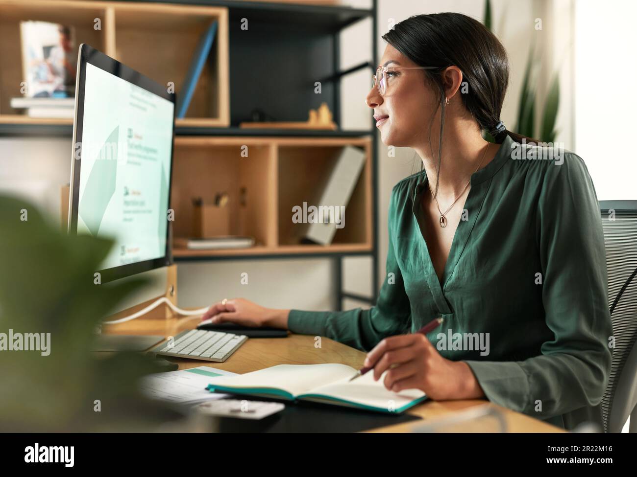 My staff members have been impressing me. a young businesswoman looking ...