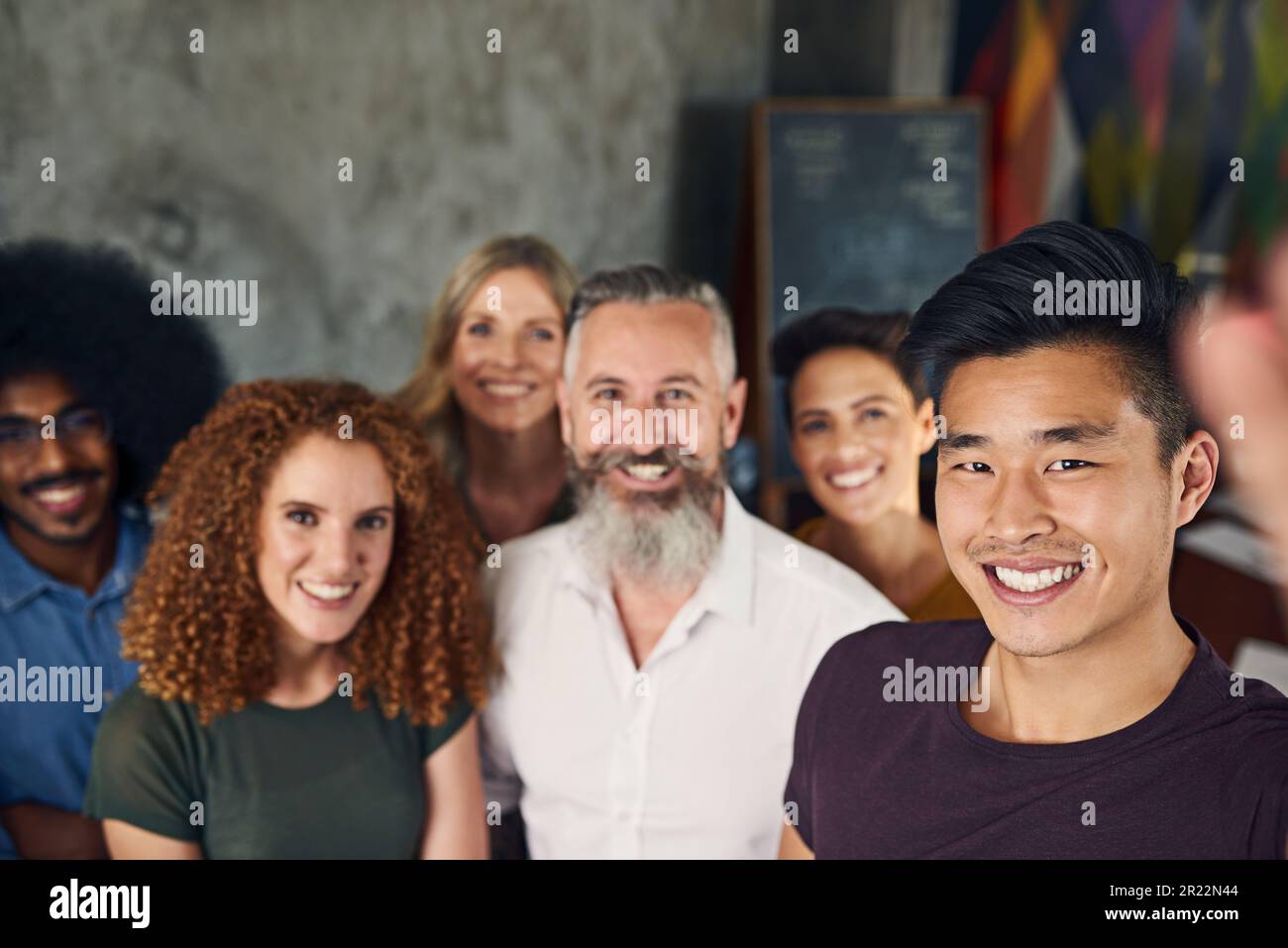 We hold great potential as a team. Portrait of a group of designers ...