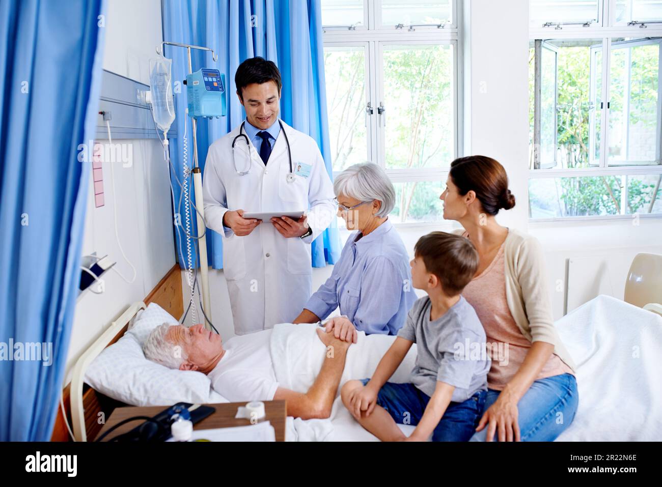 Youll be going home soon. a doctor delivering results to a sick man in ...