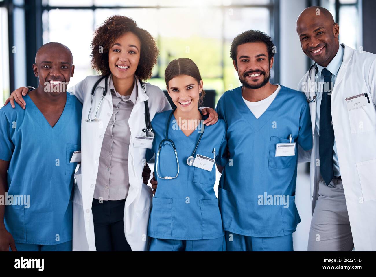 There is no other better team around. Portrait of a cheerful group of doctors standing with ...