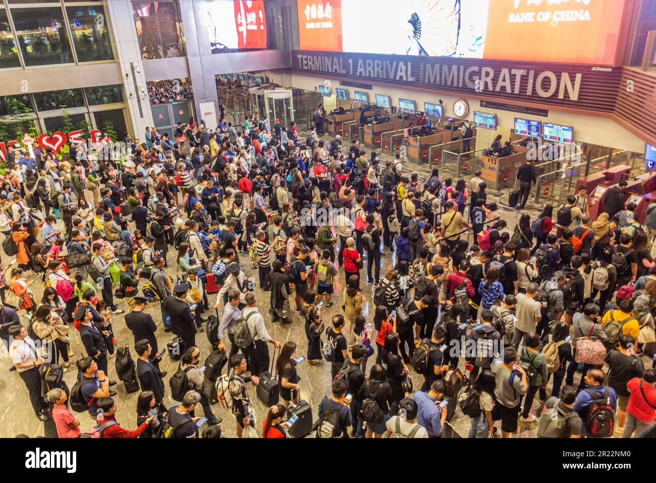SINGAPORE, SINGAPORE - DECEMBER 17, 2019: Long lines at Singapore ...