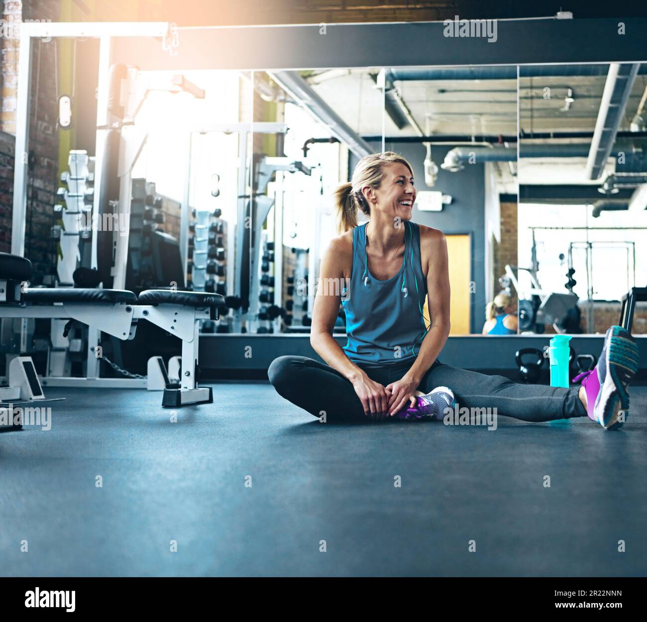 Im just a happier person when I work out. a sporty woman working out at ...