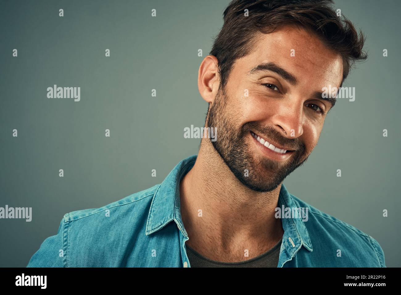 Hes an easygoing kinda guy. Studio portrait of a handsome young man ...