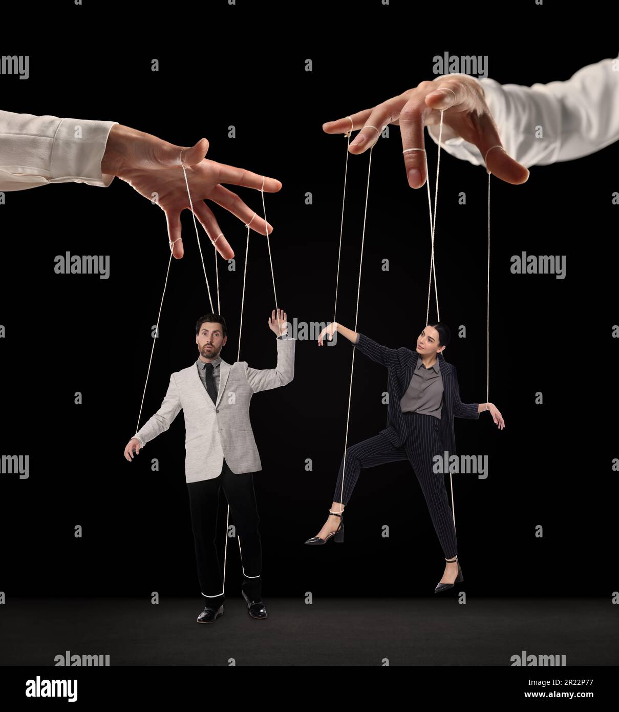 Human relationships demonstrated in puppet show. Workers manipulated by ...