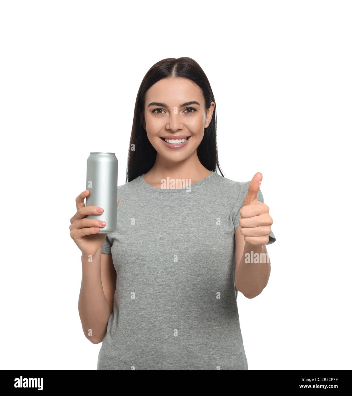 Beautiful happy woman holding beverage can and showing thumbs up on ...