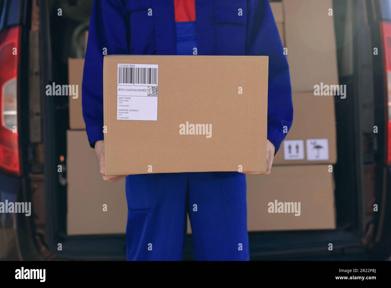 Young courier parcel near hi-res stock photography and images - Alamy