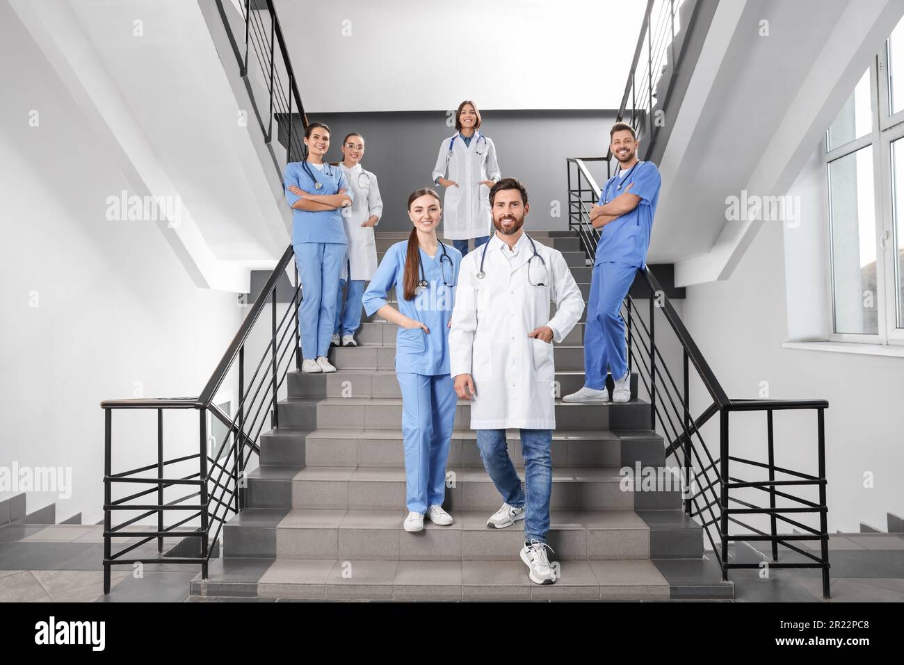 Medical students wearing uniforms on staircase in college Stock Photo ...