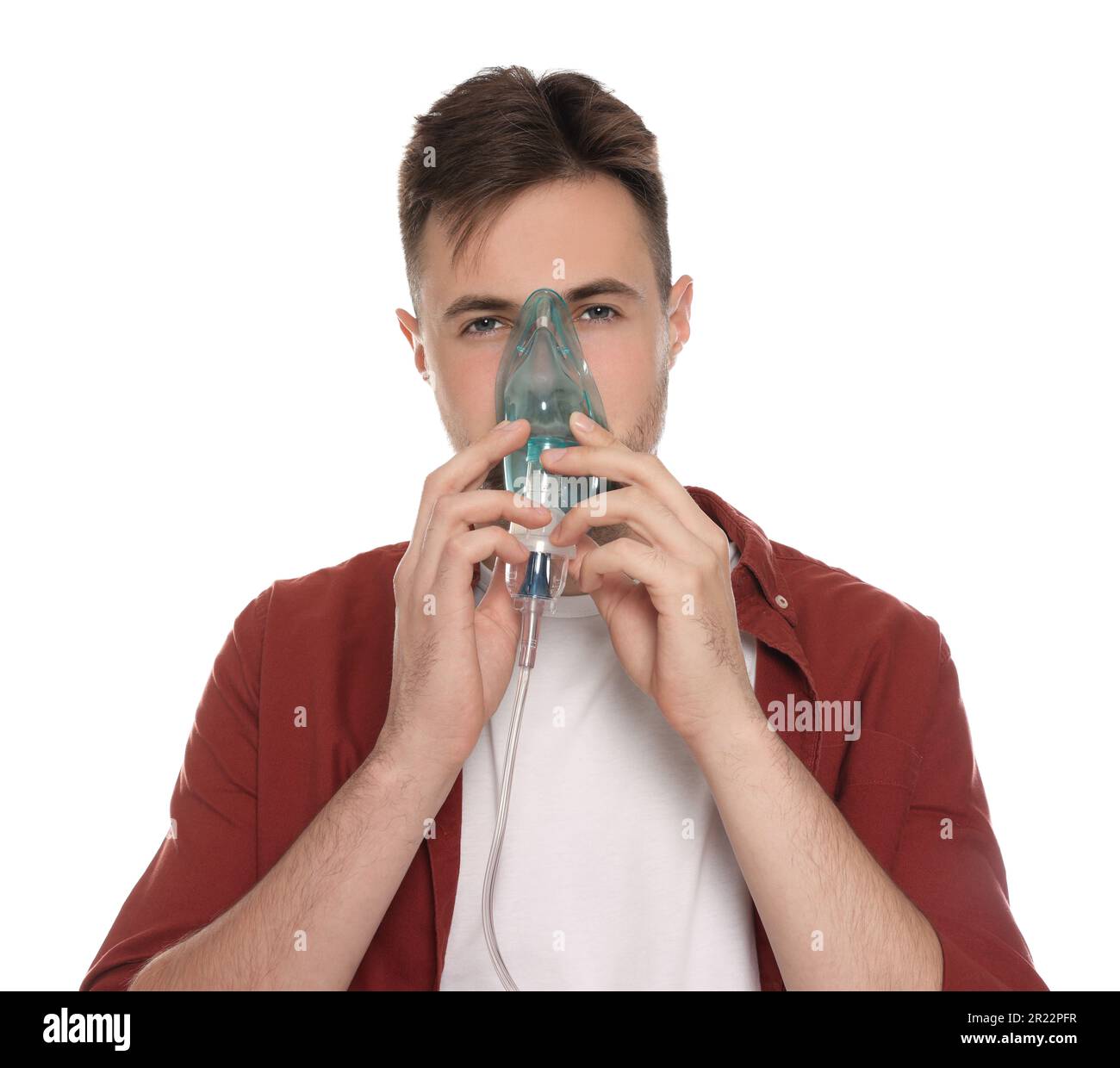 Man using nebulizer for inhalation on white background Stock Photo - Alamy