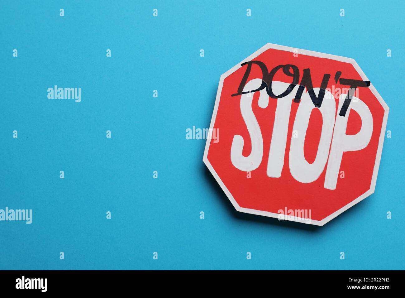 Don't stop - motivational phrase. Road sign sticker with added written ...