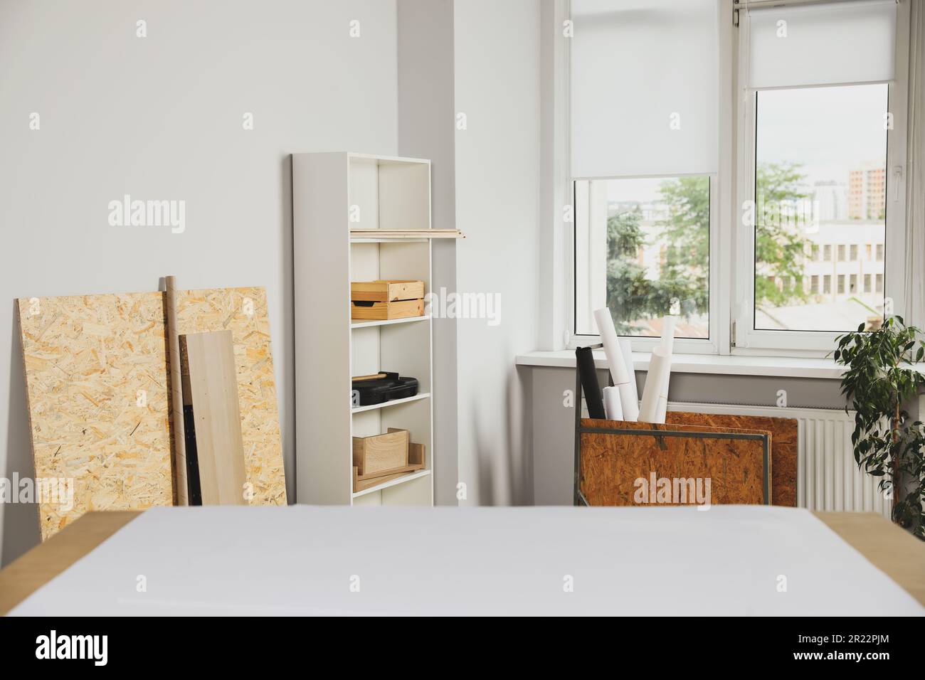Interior of workshop with materials and window Stock Photo - Alamy