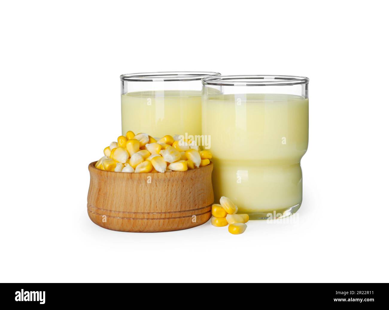 Tasty fresh corn milk in glasses and kernels on white background Stock ...