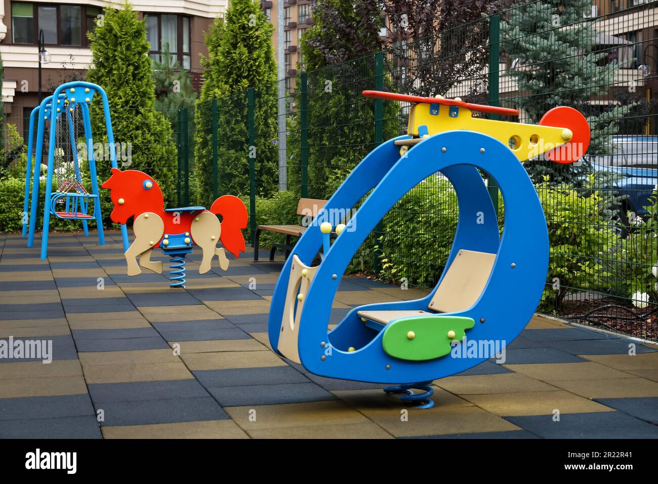 Empty spring rider on children's playground in residential area Stock ...
