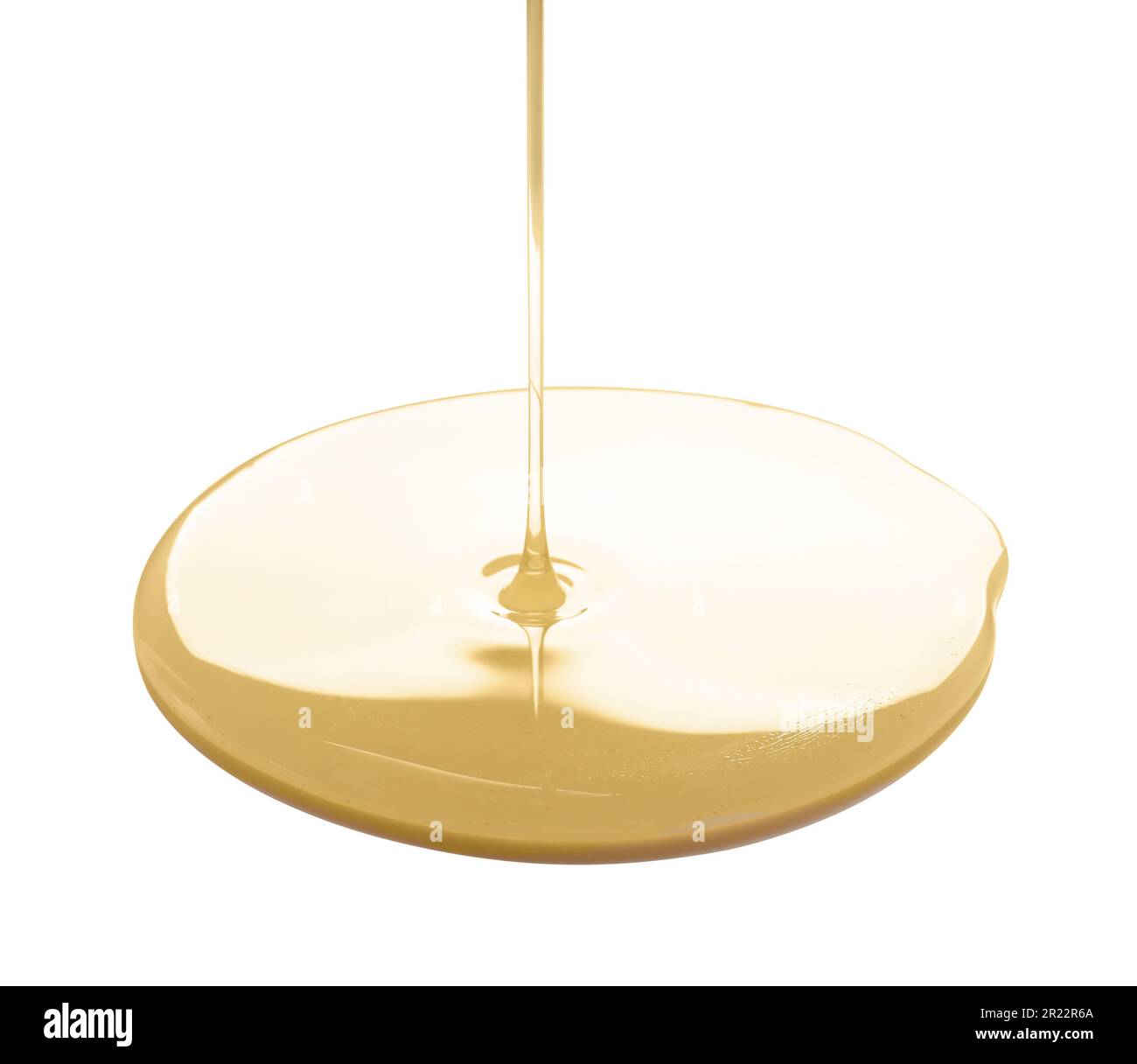 Vegetable oil pouring to puddle on white background Stock Photo - Alamy