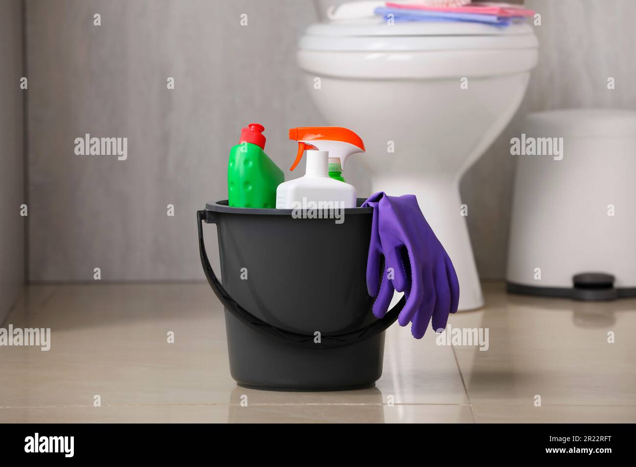 Different toilet cleaning supplies on floor indoors Stock Photo - Alamy