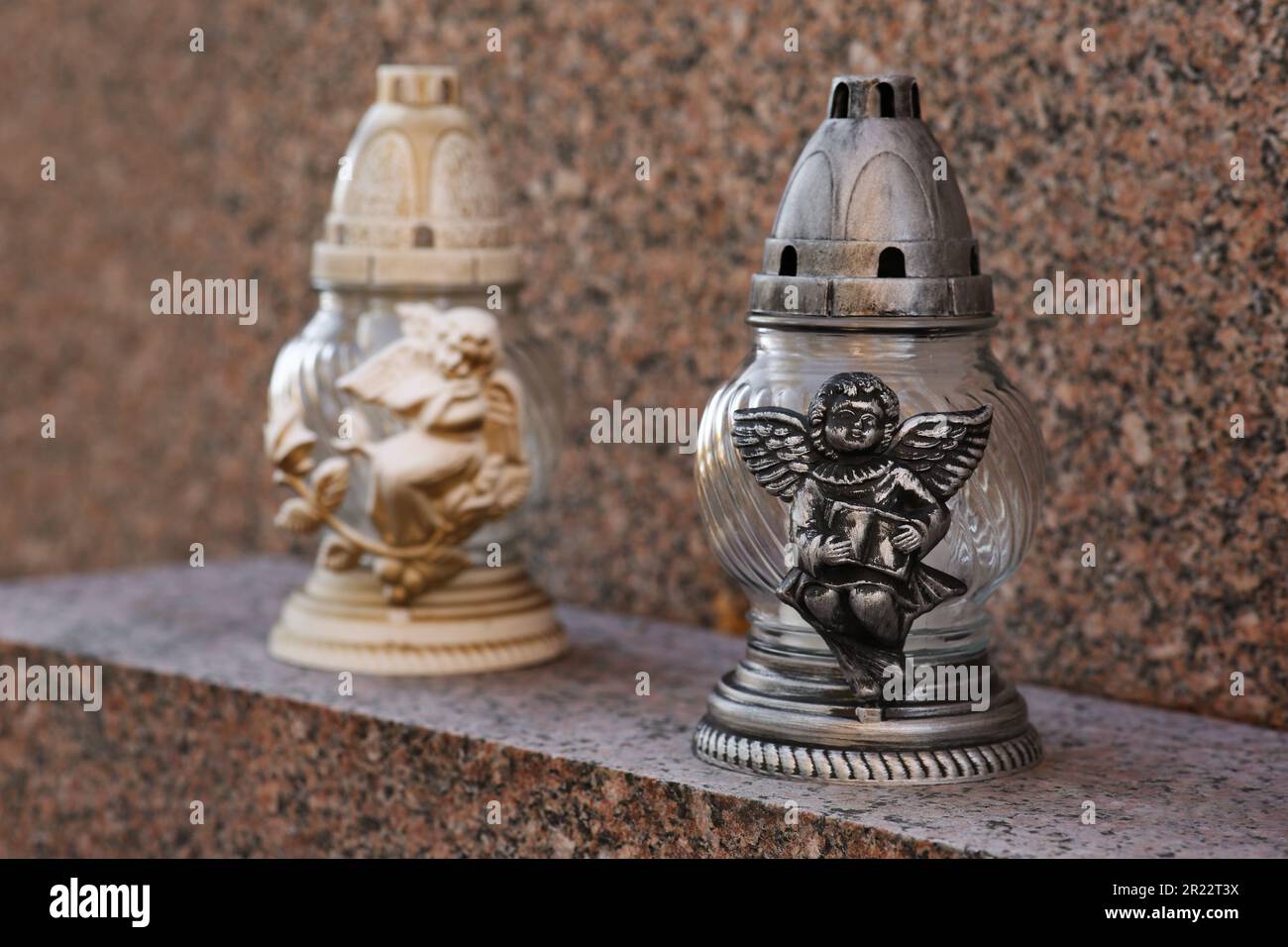 Grave lanterns on granite surface in cemetery Stock Photo - Alamy