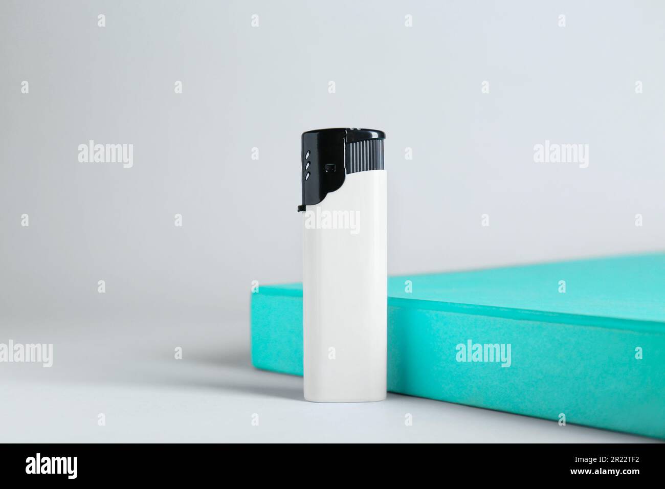 Stylish presentation of small pocket lighter on white background Stock ...