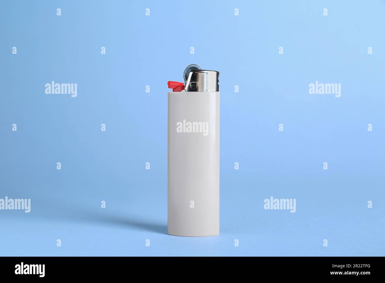 Stylish small pocket lighter on white background Stock Photo - Alamy