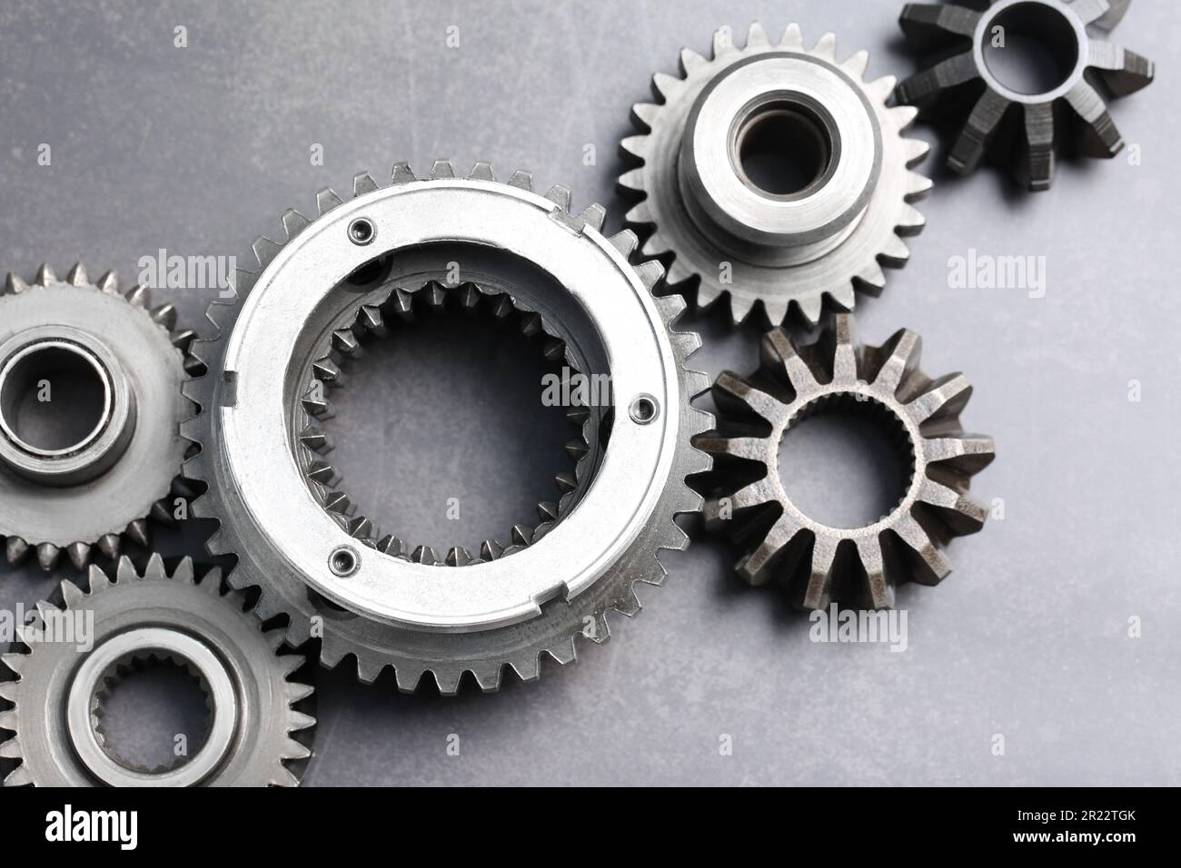 Different stainless steel gears on grey background, flat lay Stock ...